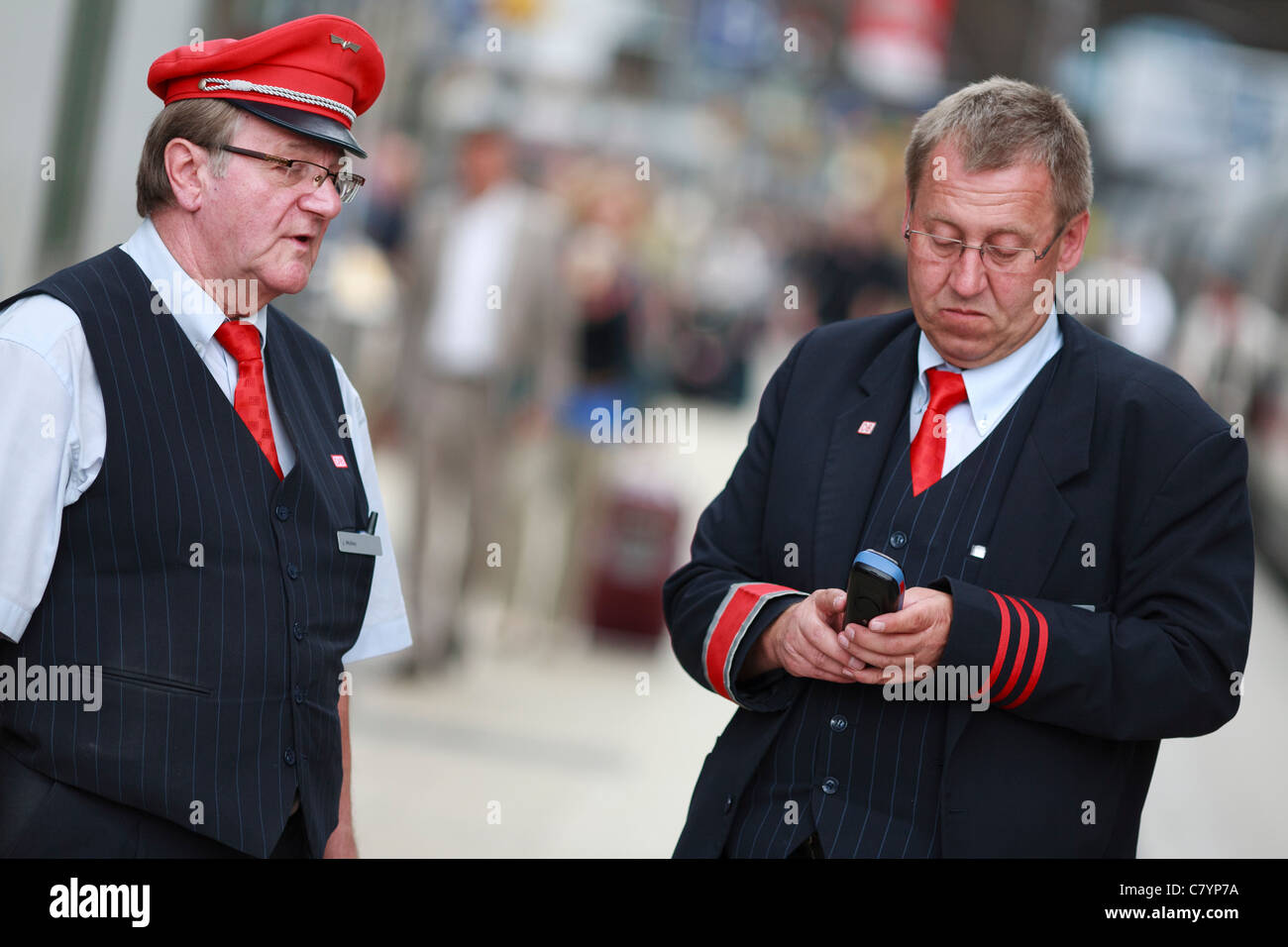 Two german train guards at Franfurt main train station in the german ...