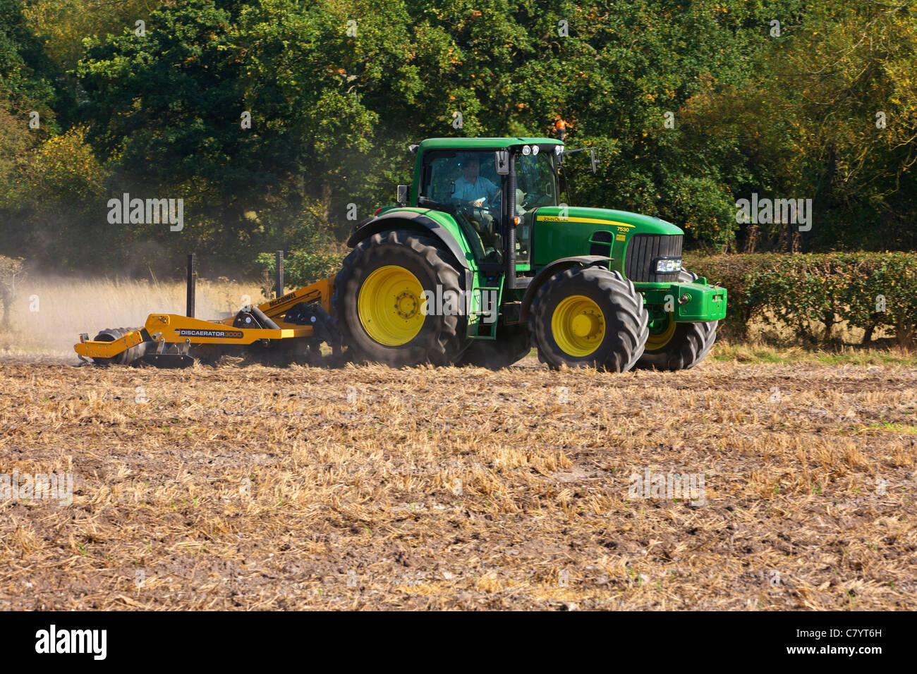 John Deere Tractor Cultivating a field after Harvest Stock Photo - Alamy