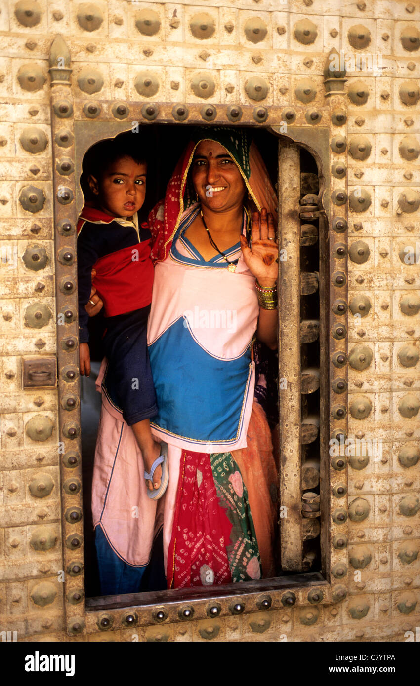 India, Rajasthan, Woman carrying little boy Stock Photo - Alamy