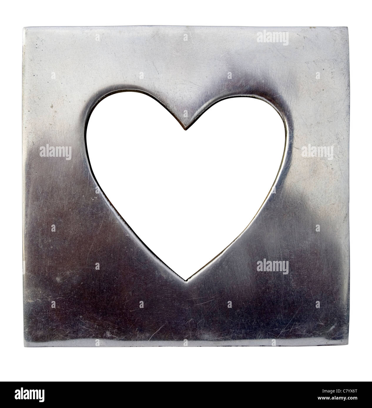 A polished metal heart shaped picture frame, isolated on white with ...
