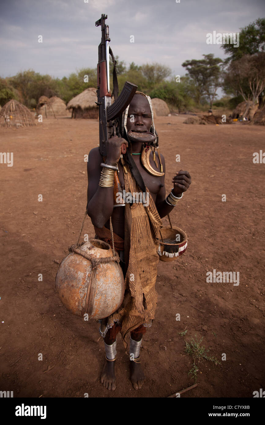 Mursi woman with lip disk and AK47, Jinka, Omo Valley, Ethiopia, Africa ...