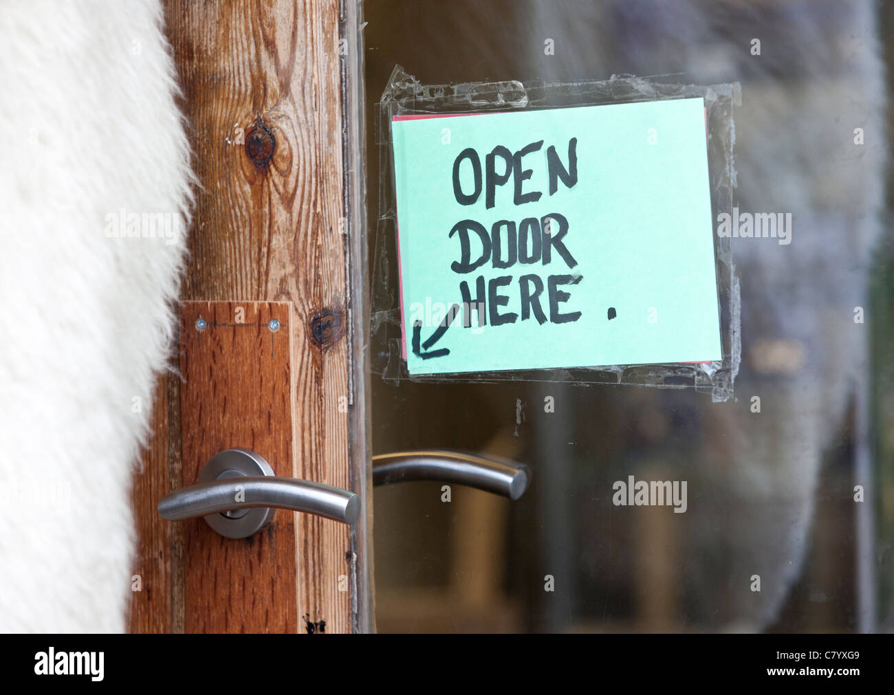 A sign on a door explains where to open it Stock Photo - Alamy