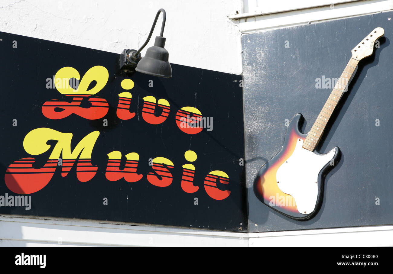 live music sign with guitar Stock Photo - Alamy