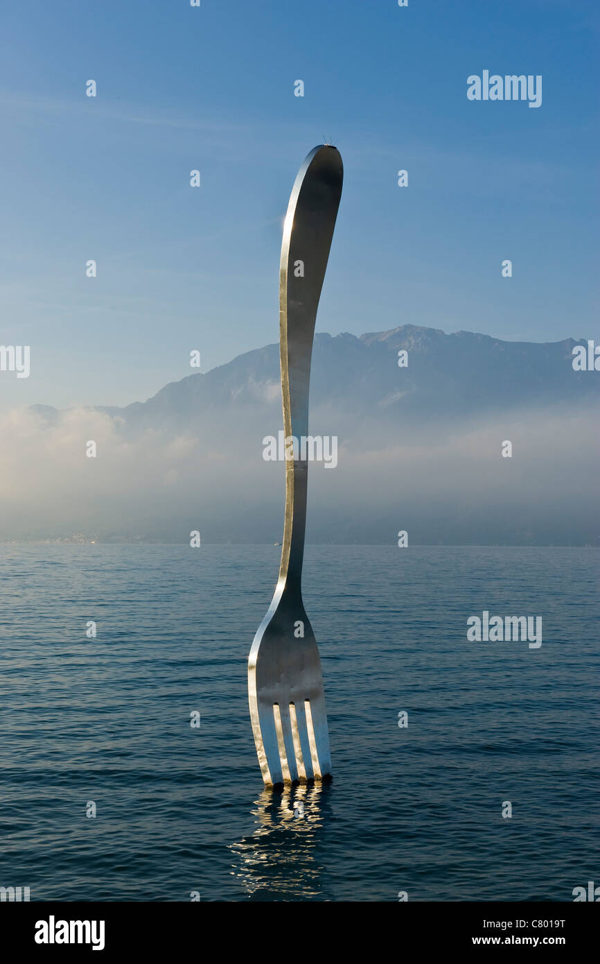 Sculpture of a giant fork stuck in water, Leman lake, Vevey ...