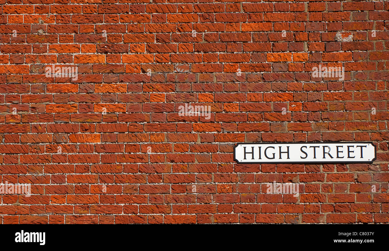 Communications, Signage, High Street sign in red brick wall Stock Photo ...