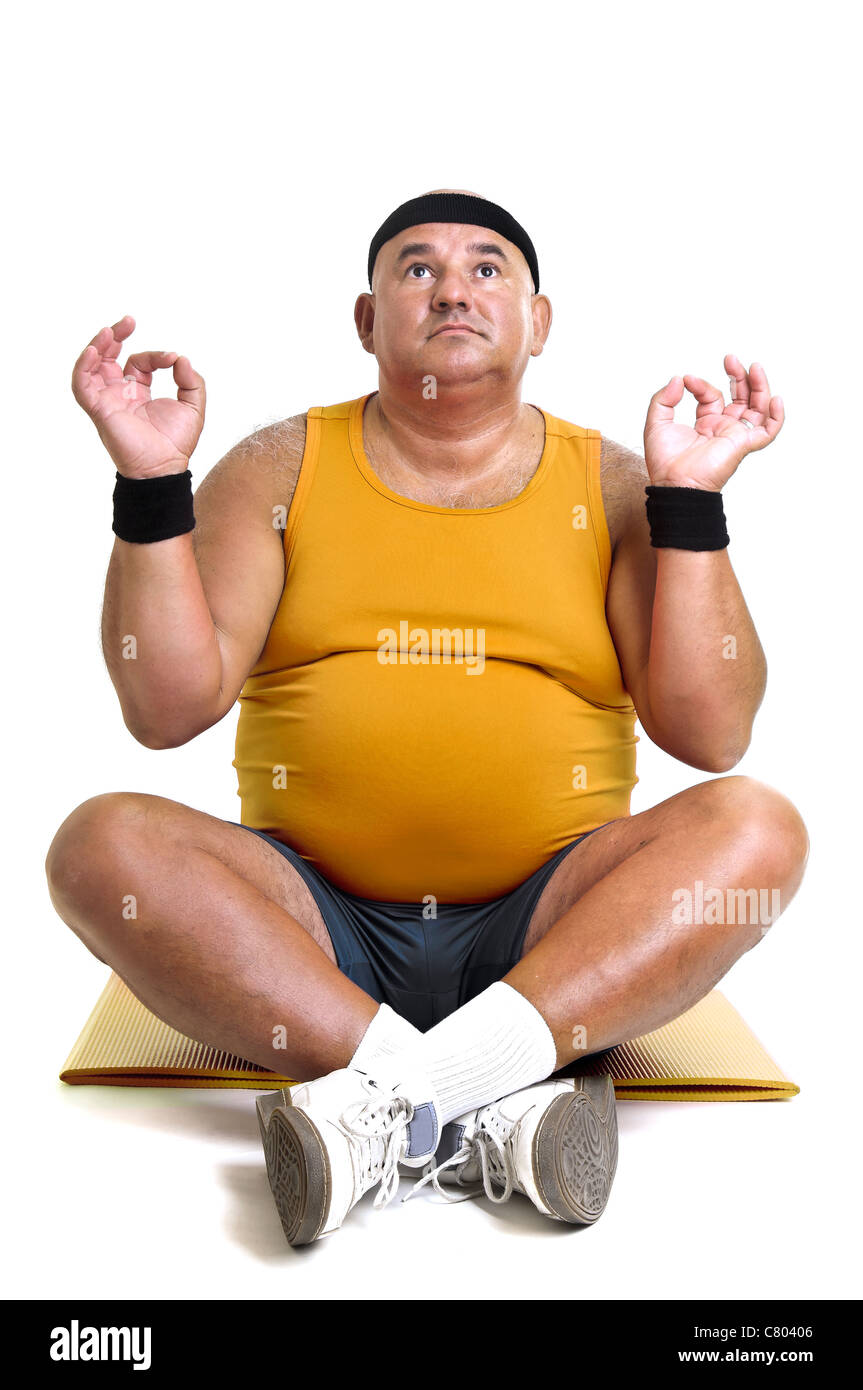 Large fitness man doing yoga exercises isolated in white Stock Photo ...