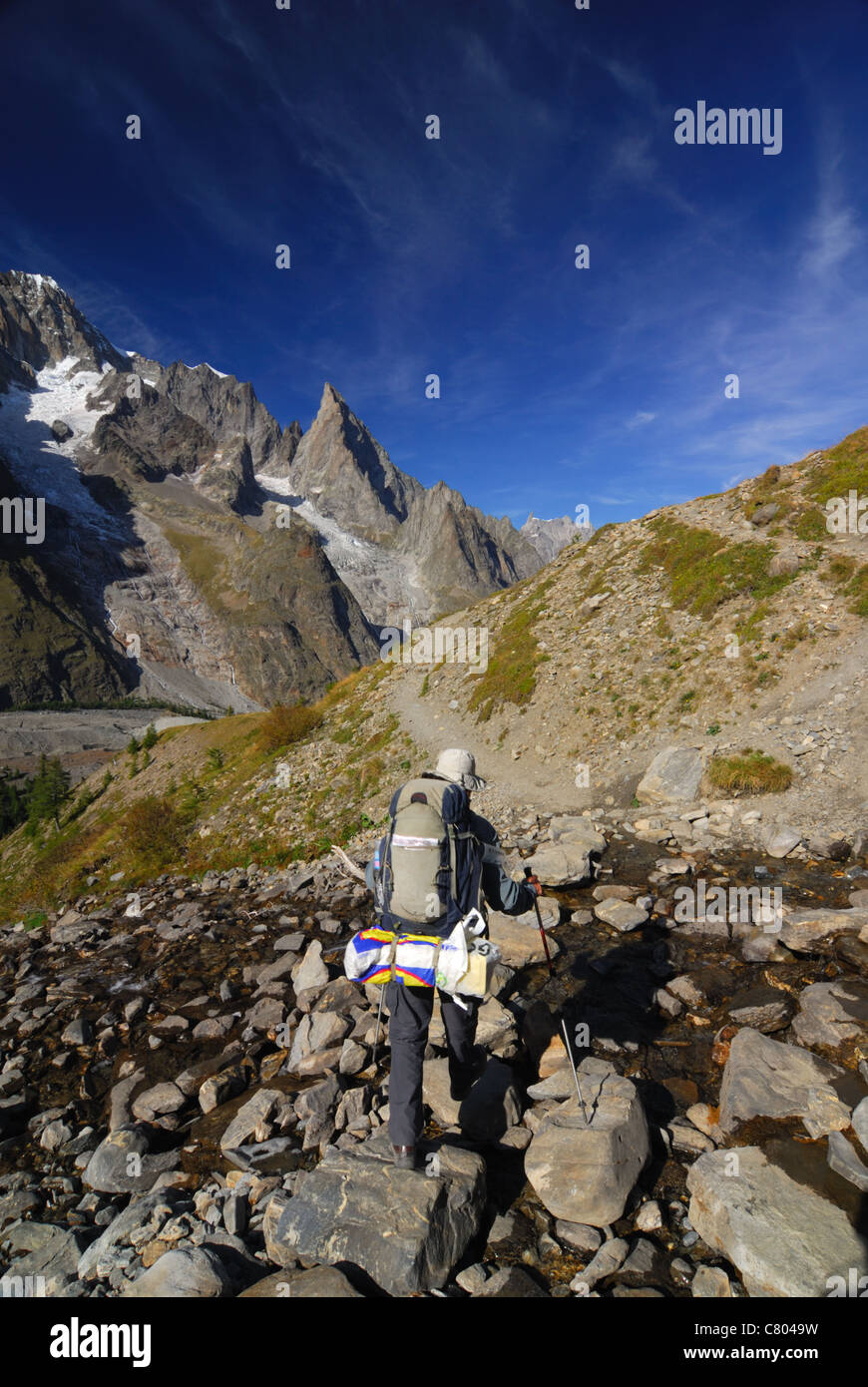 A backpacker in the Alps Stock Photo - Alamy