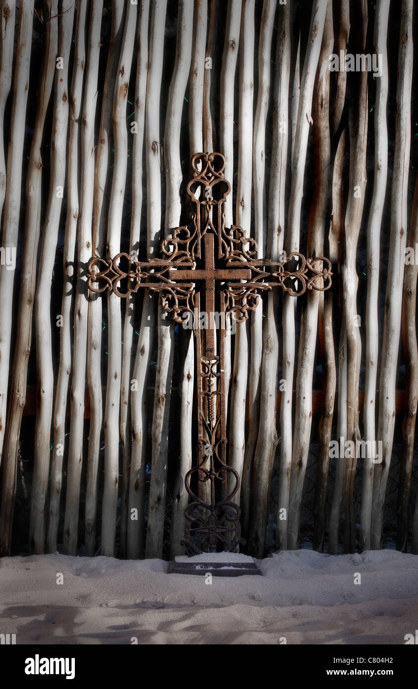 Brass metal ornate cross against wooden sticks Stock Photo - Alamy