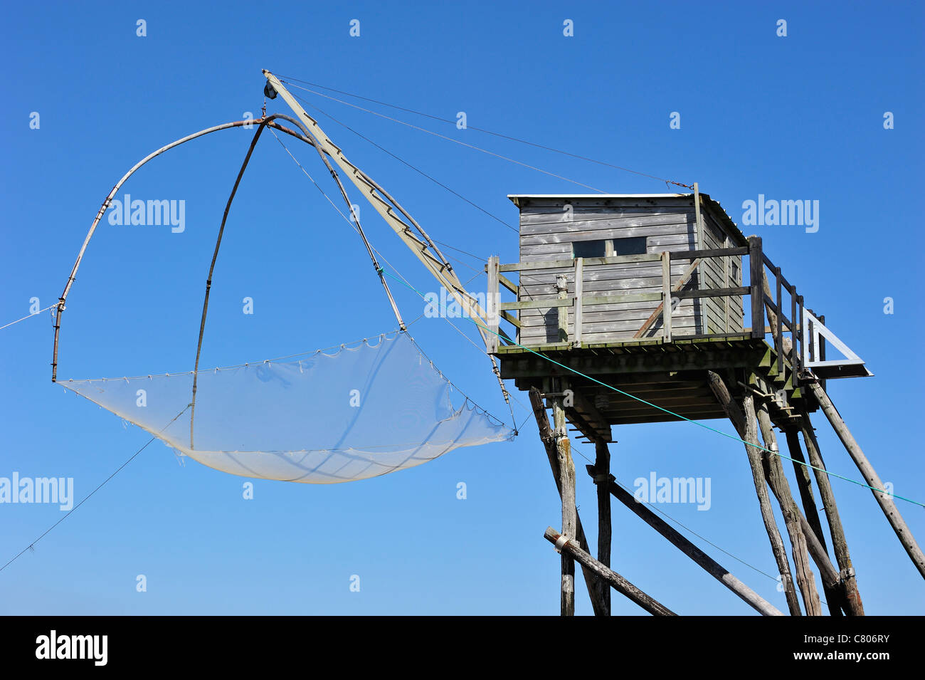 Traditional carrelet fishing hut with lift net on the beach at Saint ...