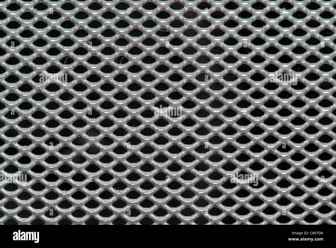 Silver metal background with elongated grill slots and light reflection ...