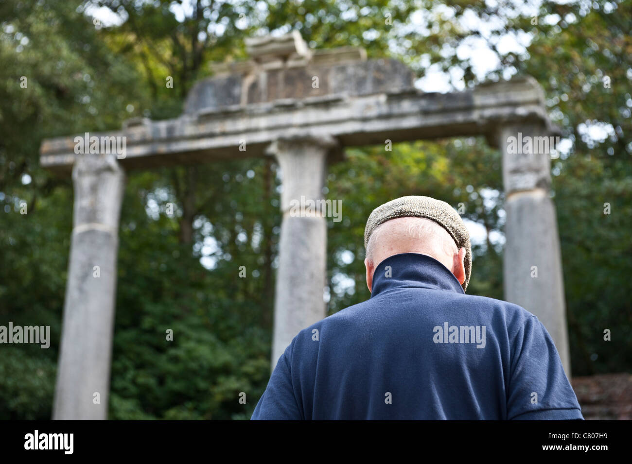 Old man visiting Virginia Water Ruins of Leptis Magna Roman City Stock ...