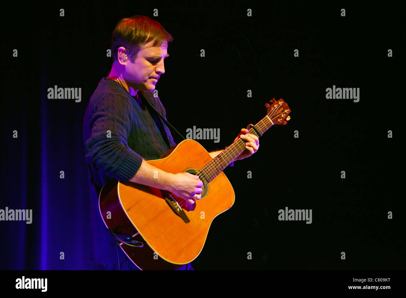 Sean McCann plays guitar for GREAT BIG SEA. a singing group from Canada ...