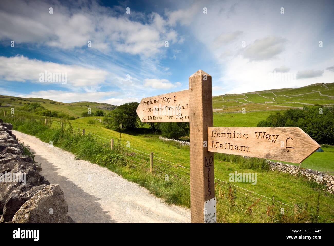 A signpost pointing to Malham Cove and the Pennine Way in the Yorkshire ...