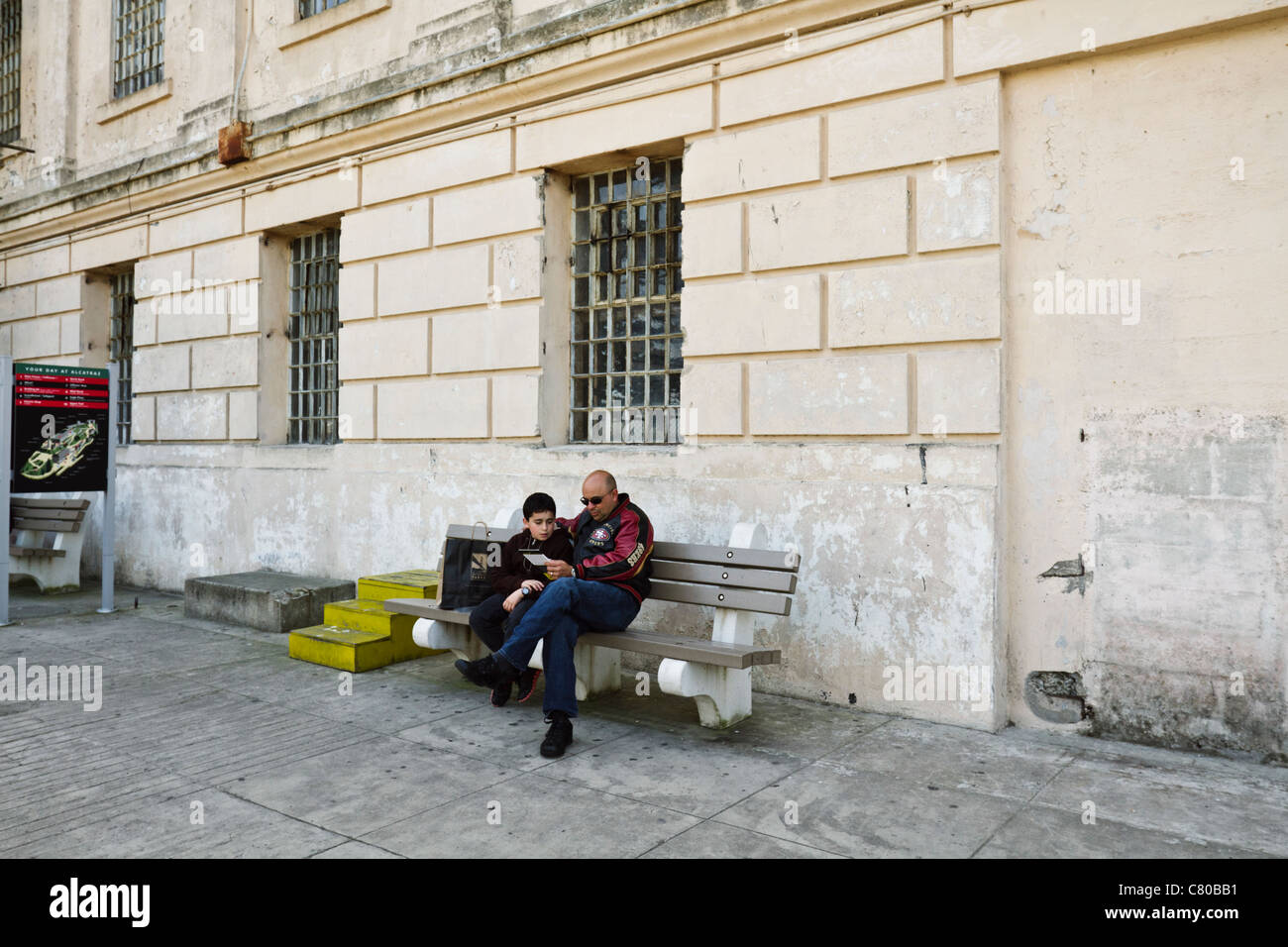 father and son sit on bench alcatraz Stock Photo - Alamy
