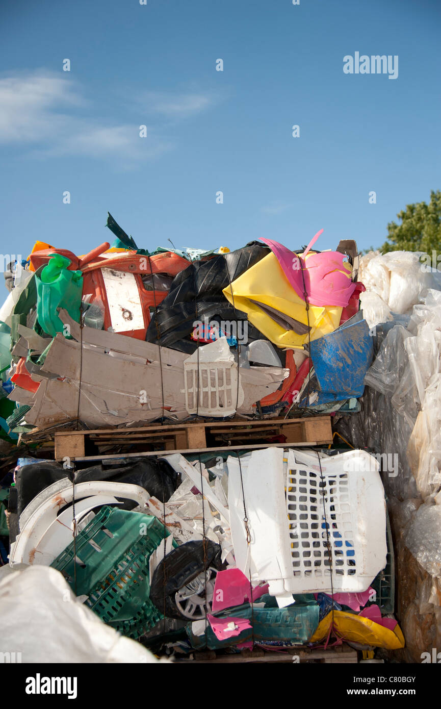 Bales of compacted hard plastic waste awaiting collection for recycling ...