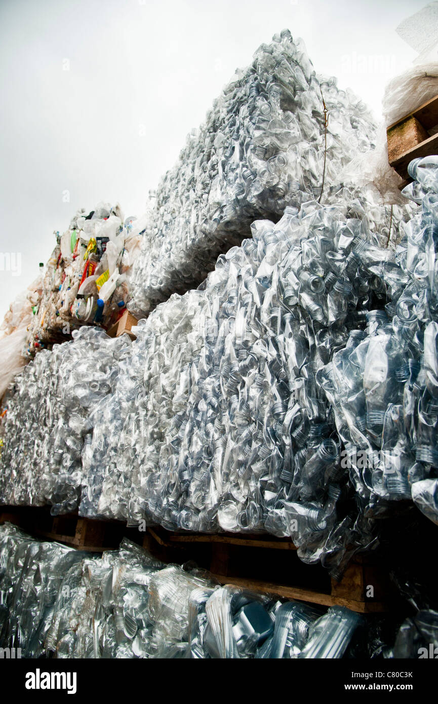 Bales of compacted waste plastic bottles awaiting collection for ...