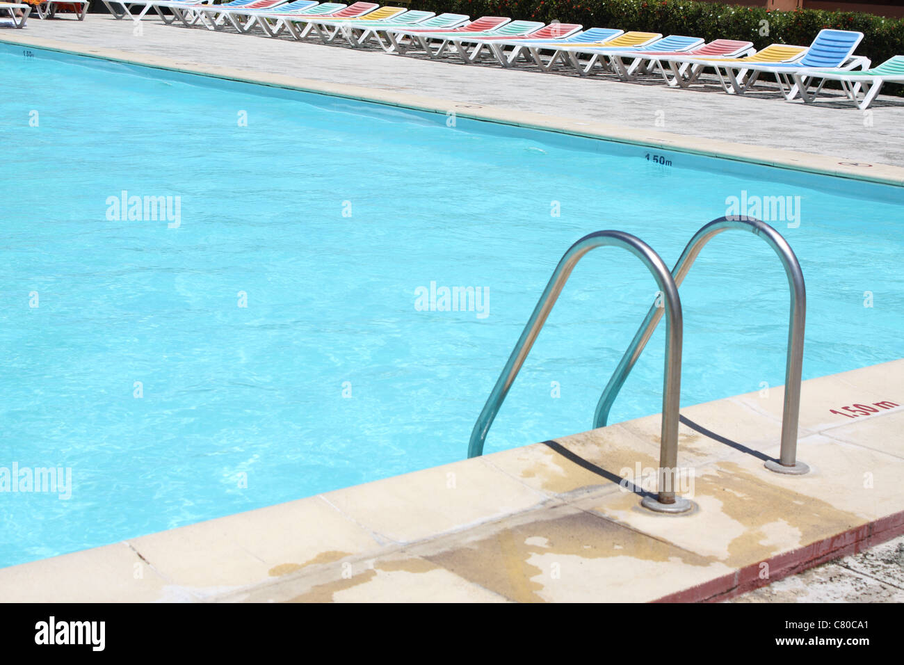 Handrail steps leading into a swimming pool Stock Photo - Alamy