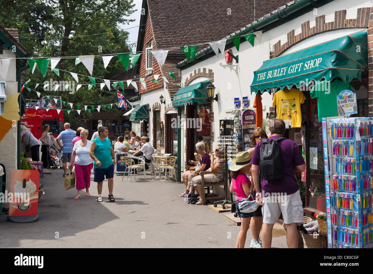 Shops and pavement cafe in the village of Burley in the New Forest ...