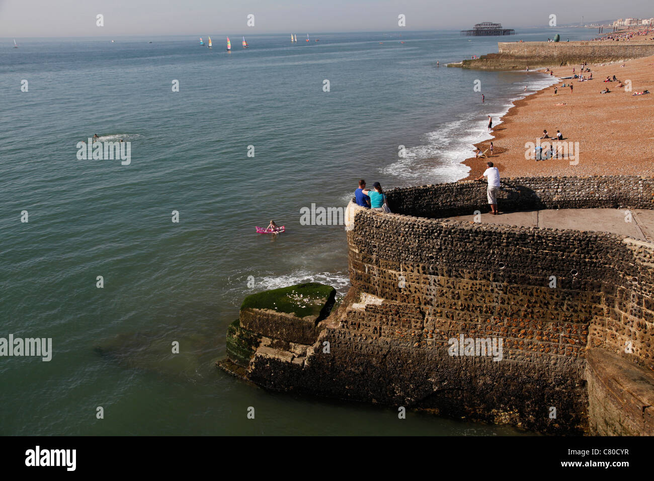 People sun bathing on the beach in Brighton, England, UK Stock Photo ...