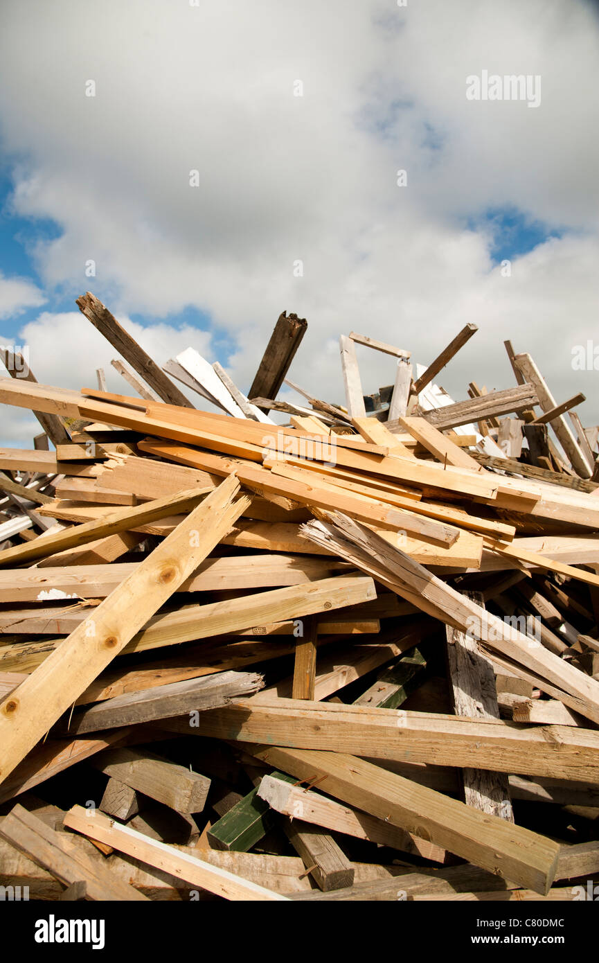 a stack of wood timber awaiting shredding at a recycling centre UK ...