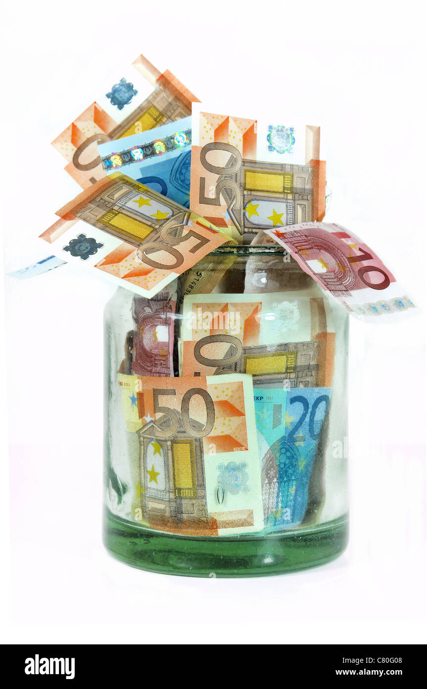 Glass jar full of Euro banknotes on white background Stock Photo - Alamy