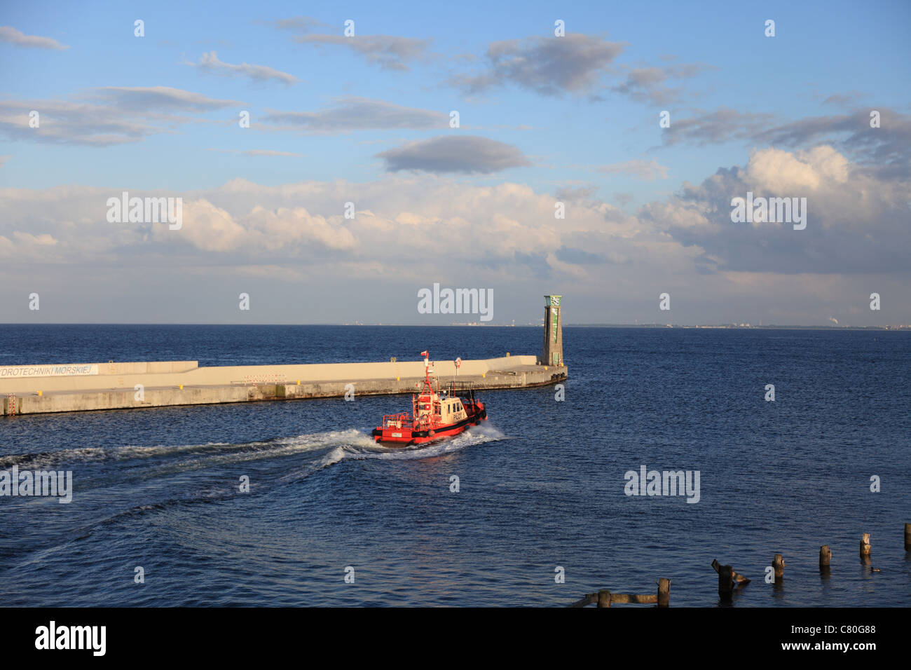 Ship on clear sea surface - breakwater Stock Photo - Alamy