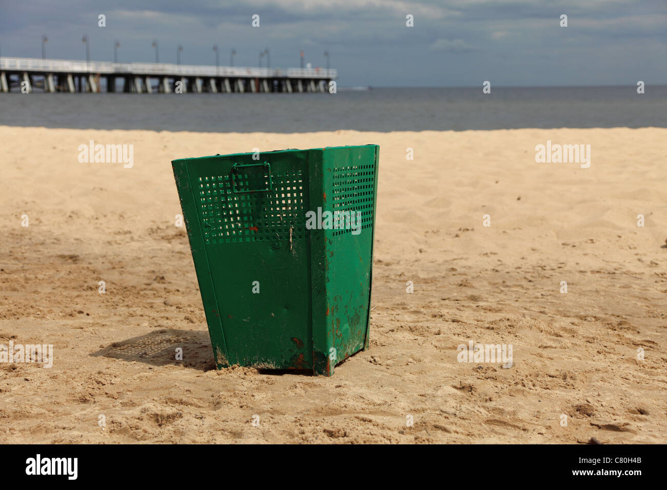 environment green bin garbageat beach Stock Photo - Alamy