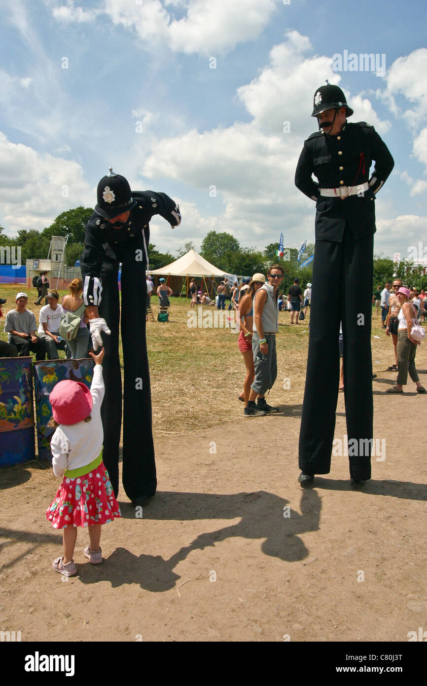 Performance police men on stilts, Glastonbury Festival 2003, Somerset ...