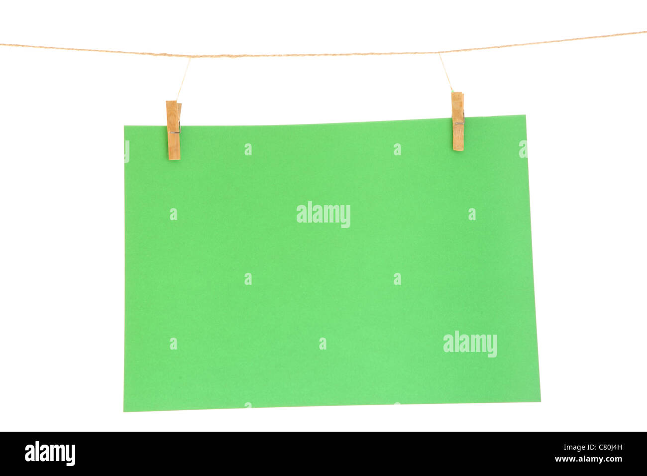 green blank paper sheet on a clothes line. Isolated on white background ...
