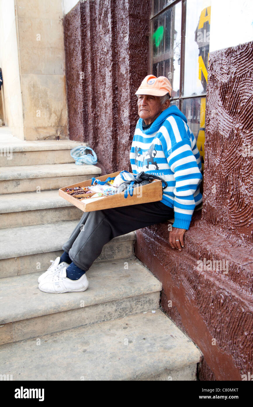peddler in the street showing her merchandise. Chiquinquirá, Boyacá ...