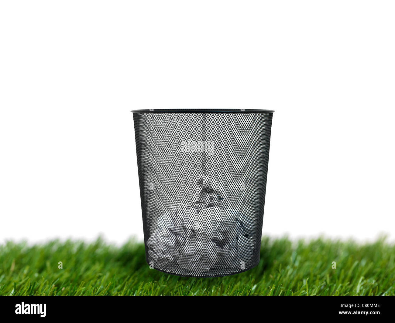 Artificial Grass and a rubbish bin isolated against a white background ...