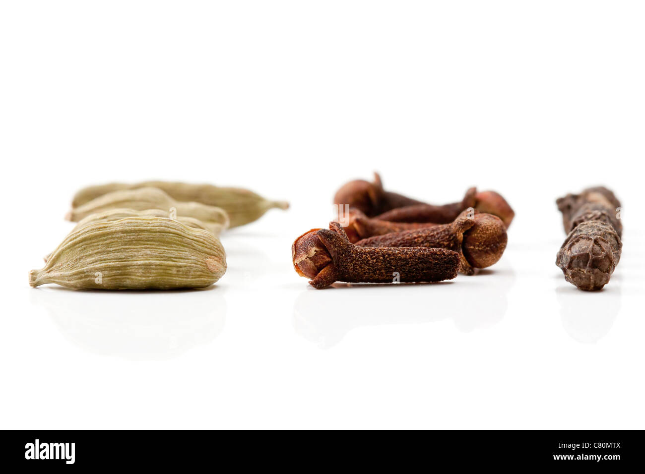 Typical Indian spices like cloves, pepper and cardamom Stock Photo - Alamy