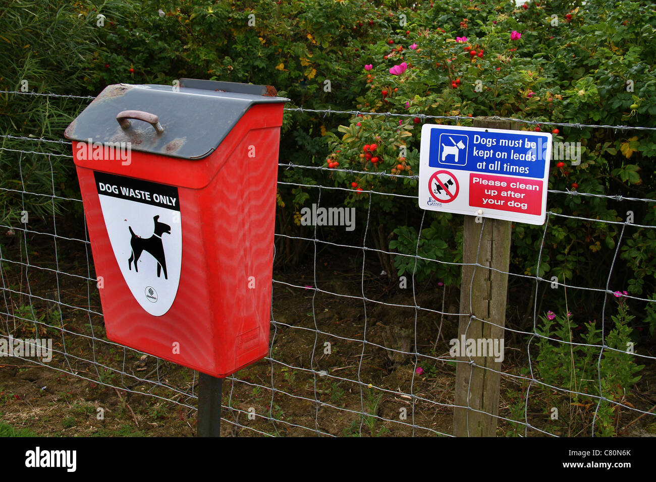 Dog fouling collection station with warning Stock Photo - Alamy