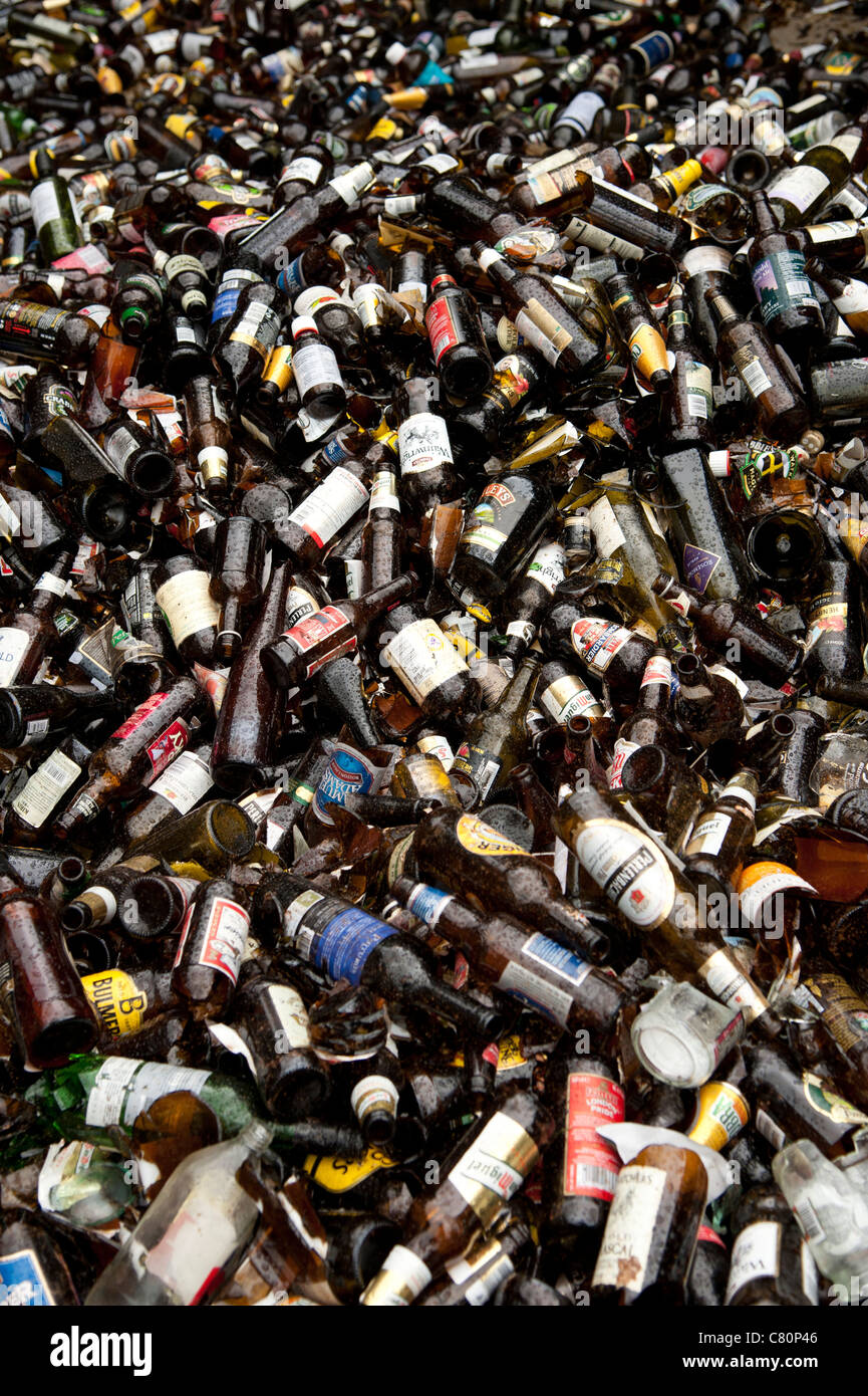 Piles of brown glass bottles at a recycling yard UK Stock Photo - Alamy
