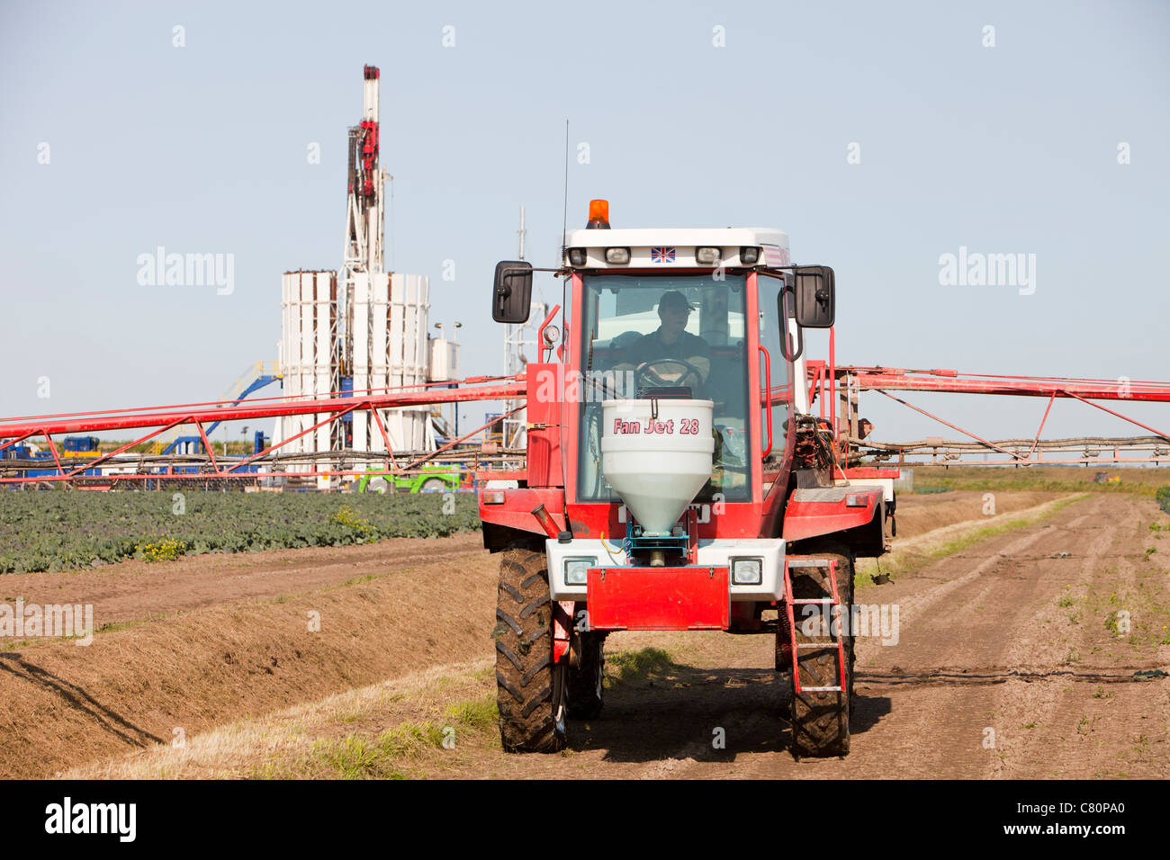 A farmer spraying his cabbages with Pesticide, Banks, Southport, UK. in ...