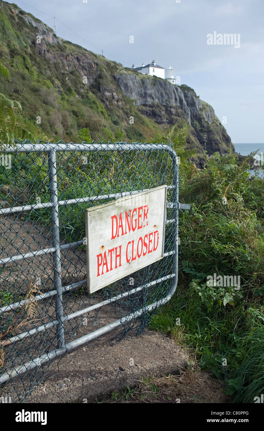 The path to Blackhead Lighthouse, closed because of rockfalls Stock ...