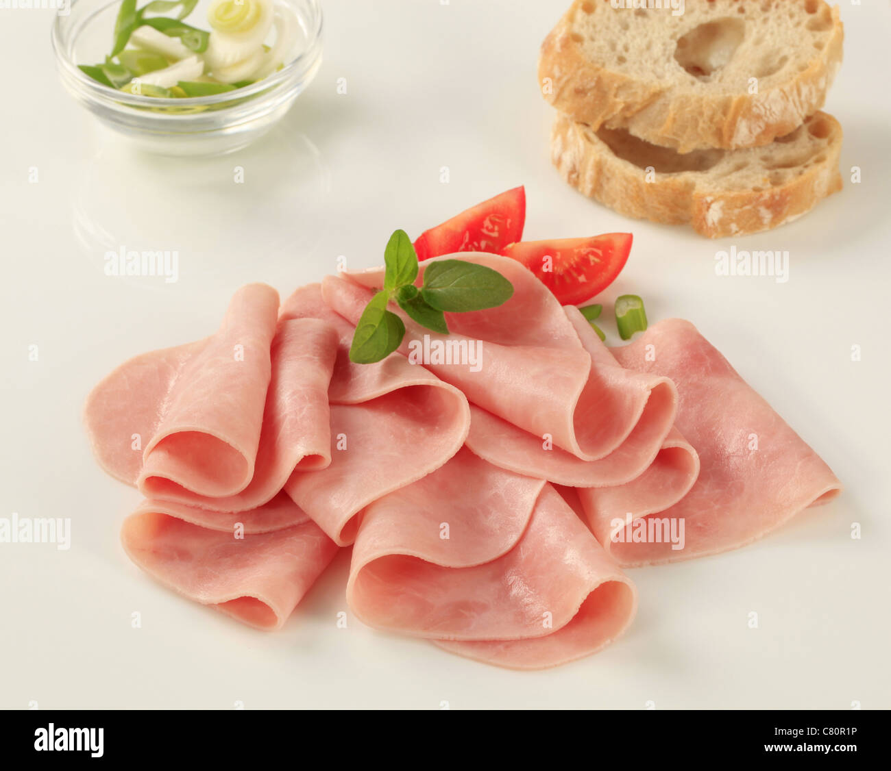 Thin slices of ham and bread - still Stock Photo - Alamy