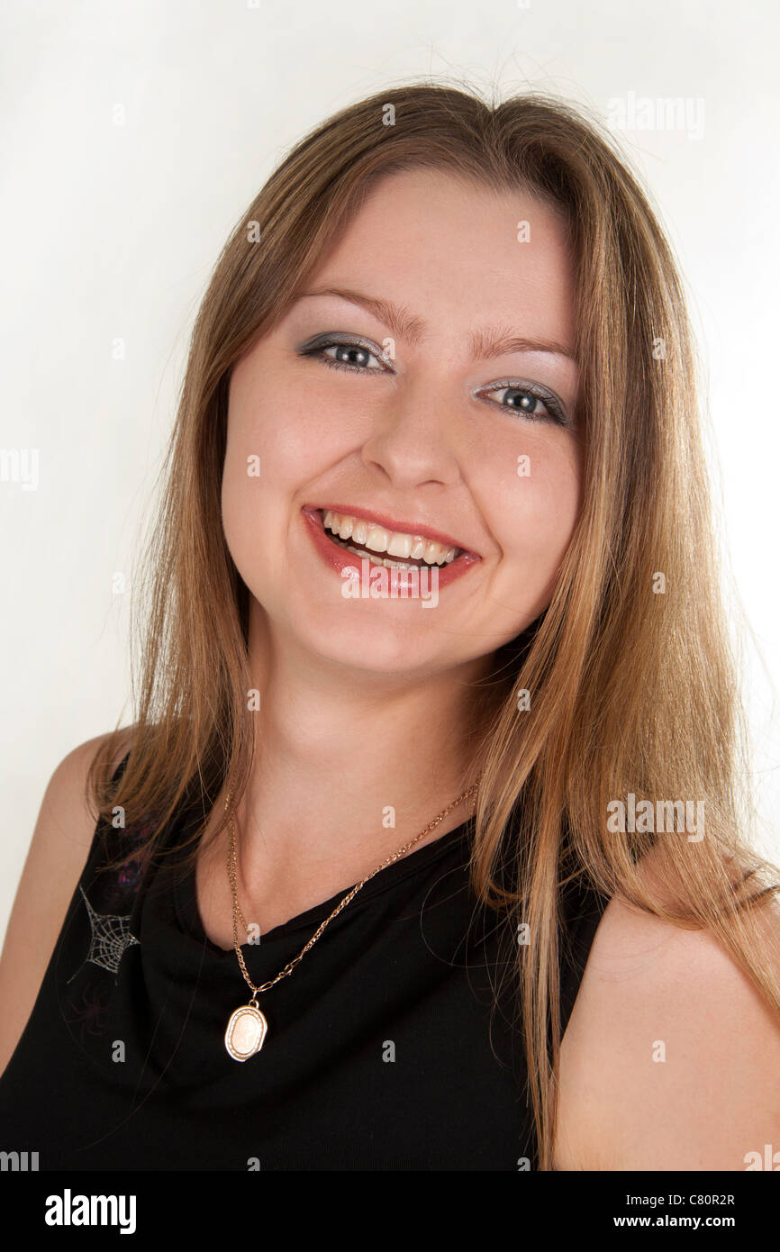 Beautiful woman smiles on a white background Stock Photo - Alamy