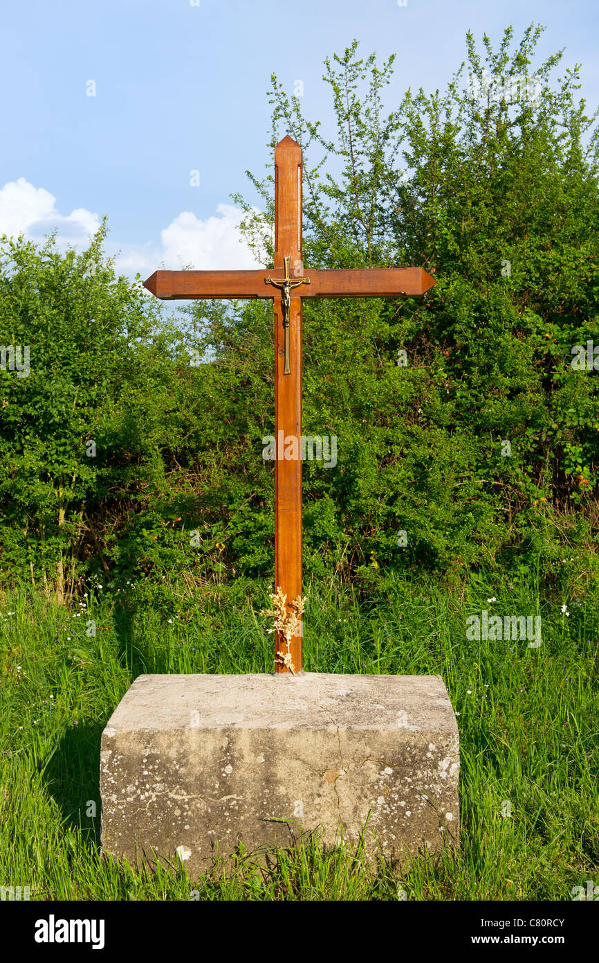 French religious wooden cross with Jesus in nature Stock Photo - Alamy