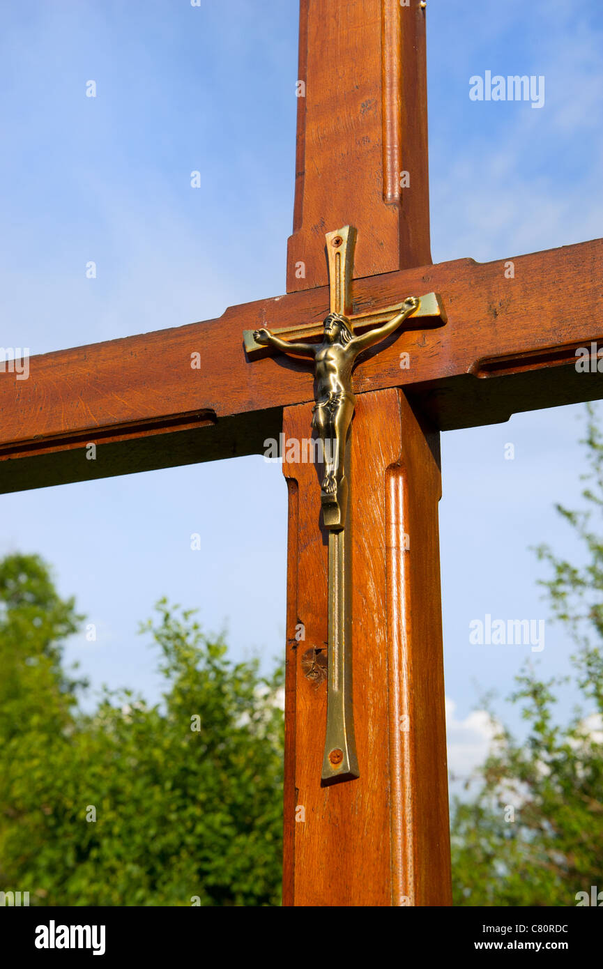 French religious wooden cross with Jesus in nature Stock Photo - Alamy