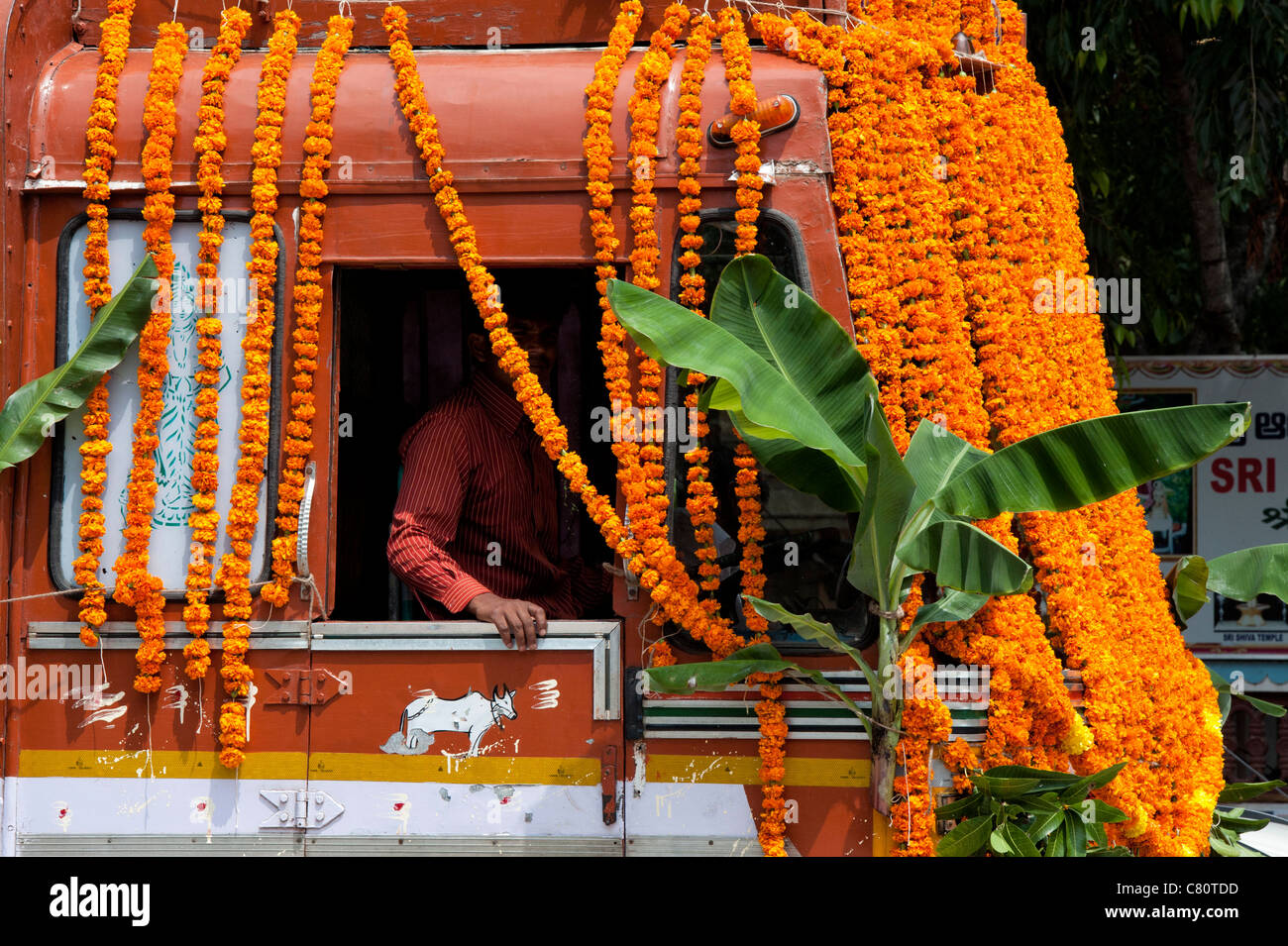Indian lorry covered in flower garlands during the Hindu festival of ...