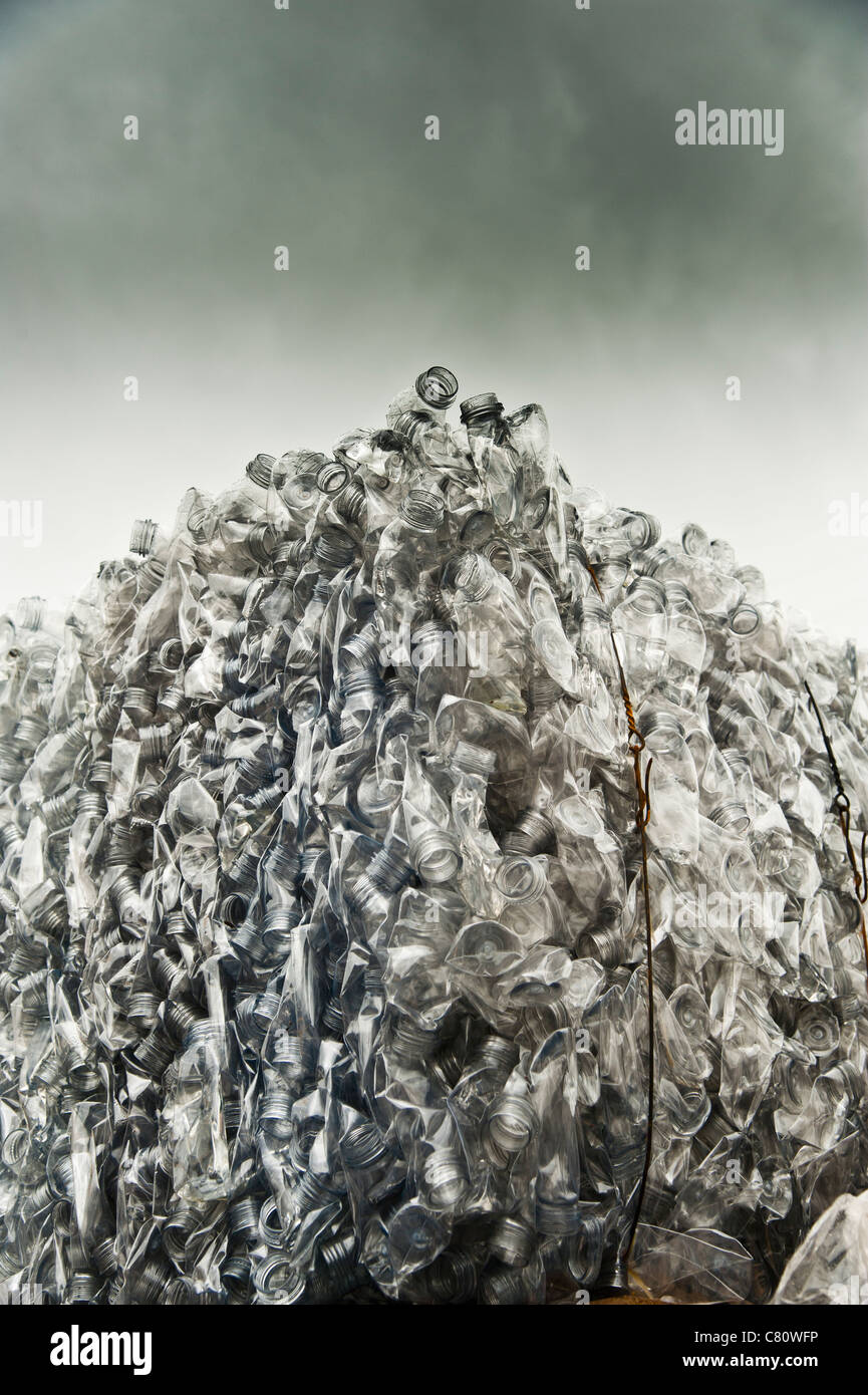 Bales of compacted waste plastic bottles awaiting collection for ...