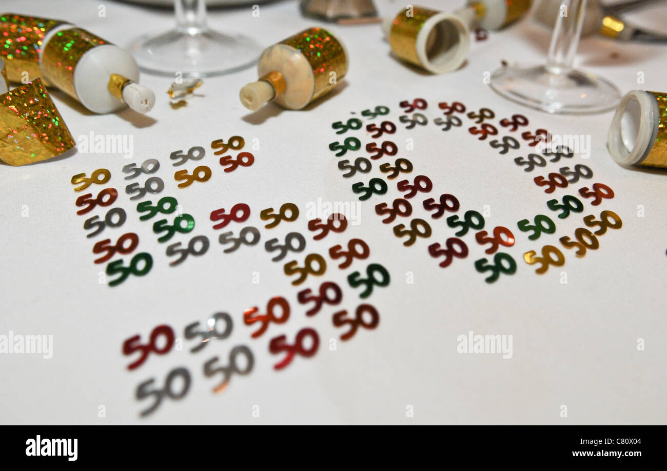 The number 50 made from glittering gold and red party popper numbers on ...