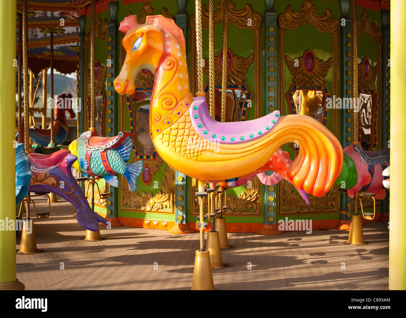 Colourful merry-go-round in Dalian, China Stock Photo - Alamy