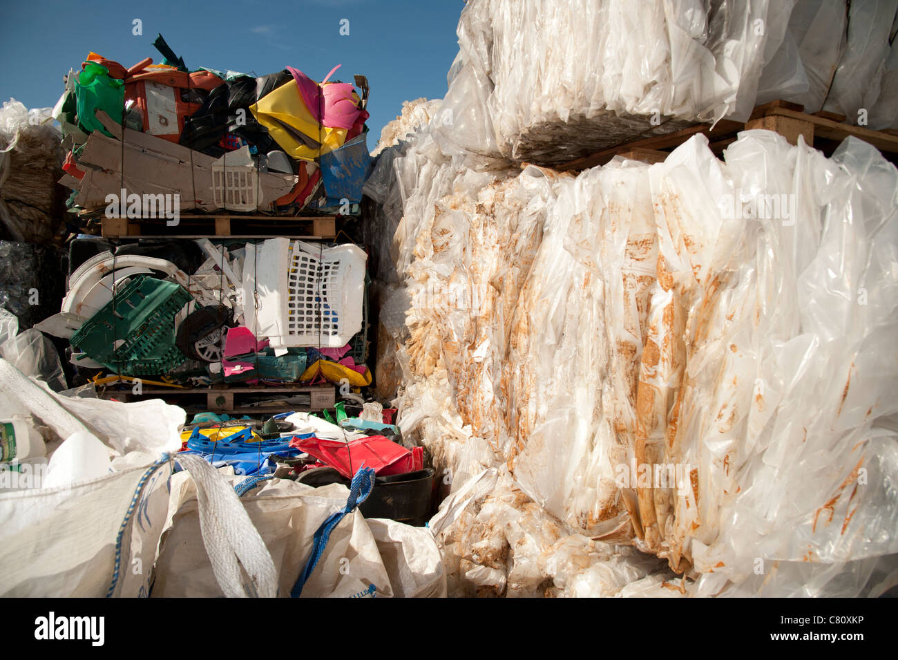 Bales of compacted waste awaiting collection at a recycling centre yard ...