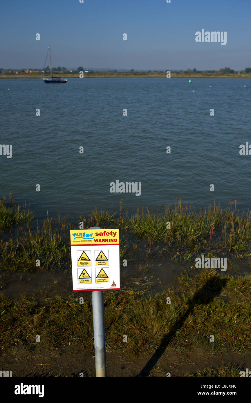 A warning sign on the banks of the River Blackwater in Essex Stock ...