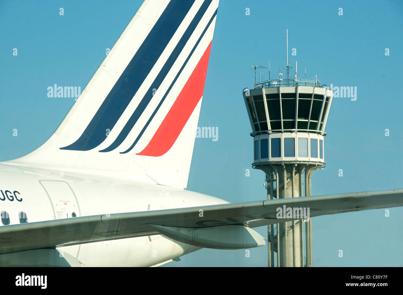 Air France plane parked beside control tower at Airport Saint Exupery ...