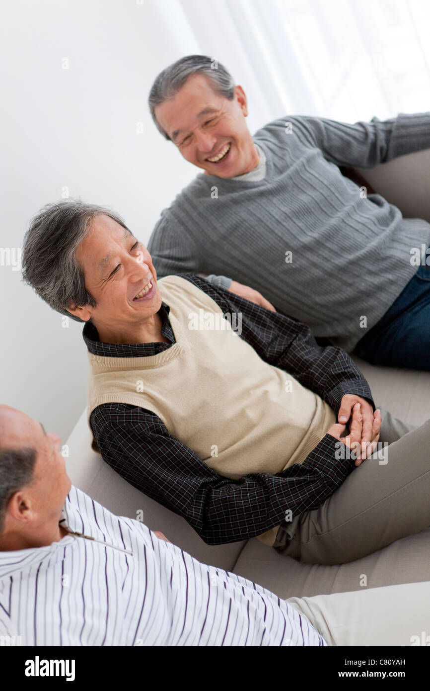 Three Senior Men on Sofa Stock Photo - Alamy