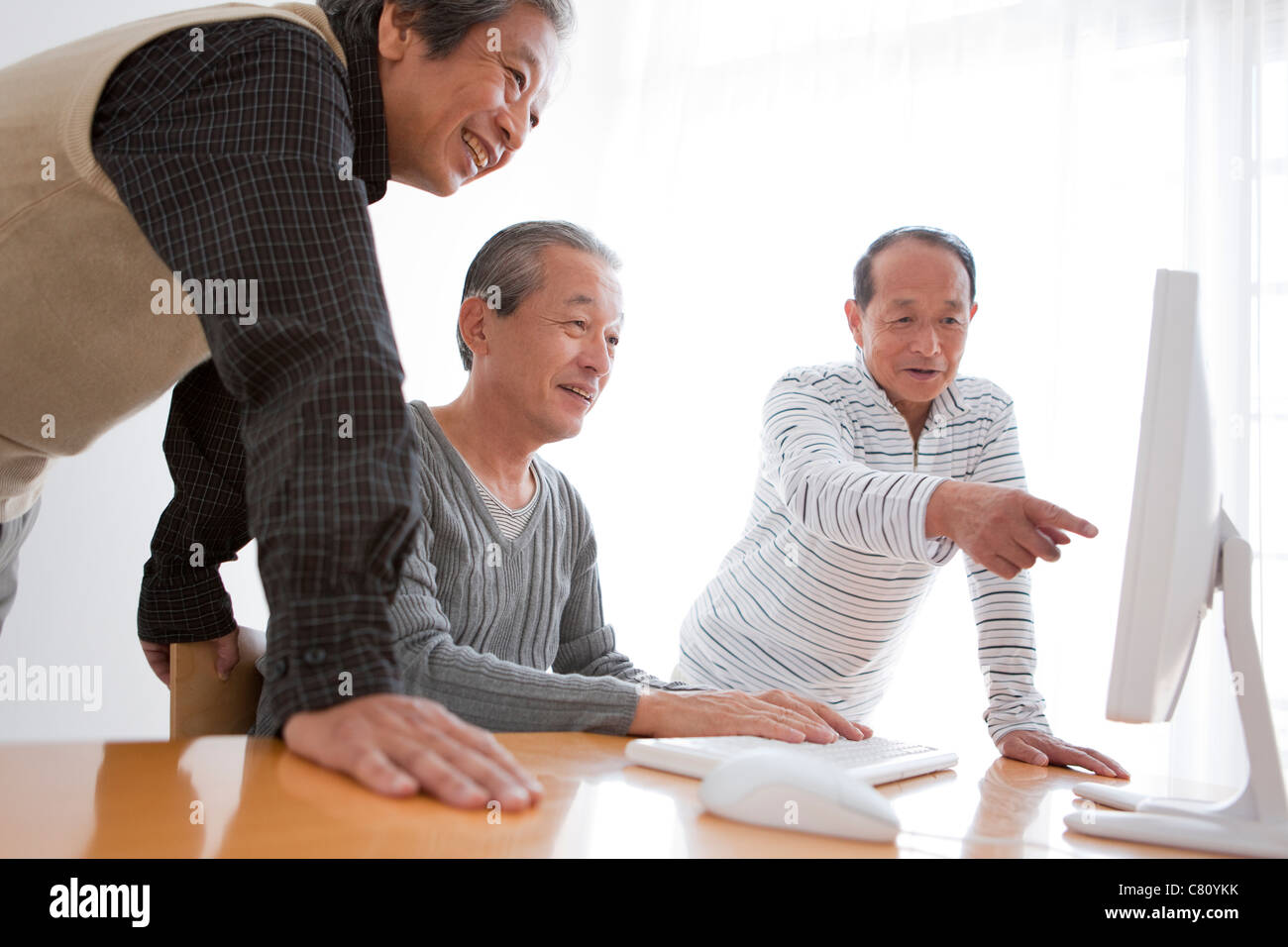 Senior Three Men at Computer Stock Photo - Alamy