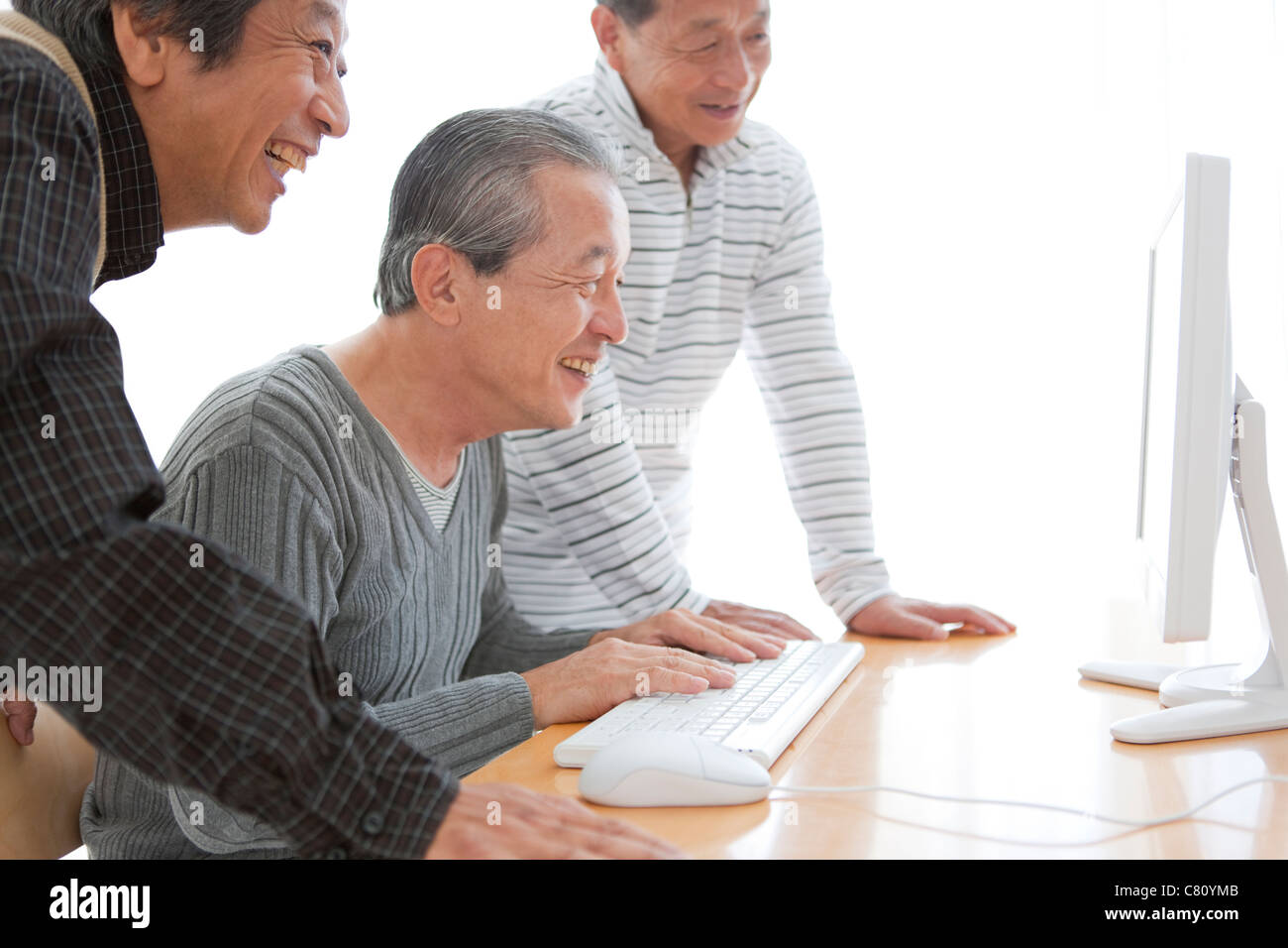Senior Three Men at Computer Stock Photo - Alamy